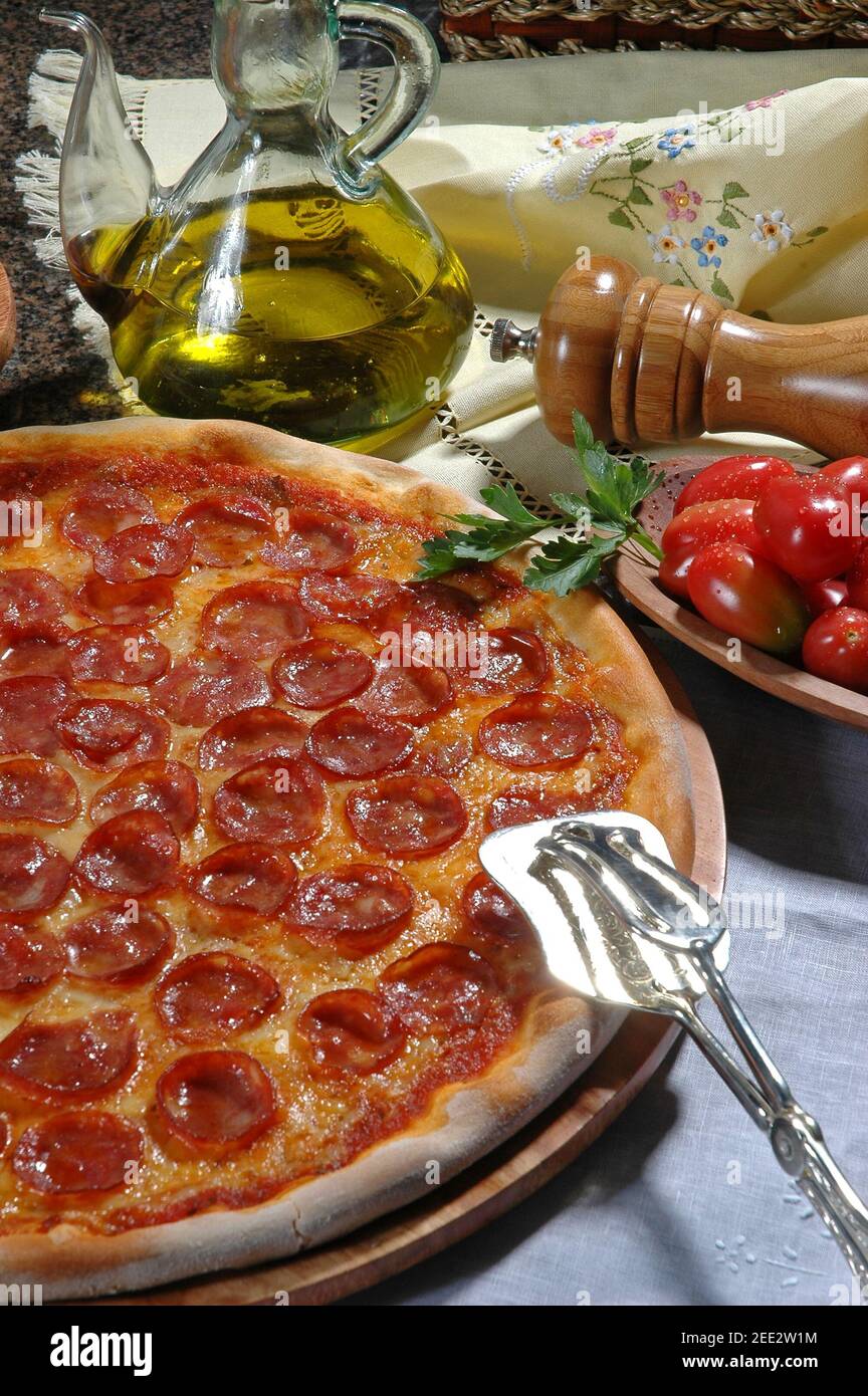 Pizza pepperoni with olive oil Stock Photo - Alamy