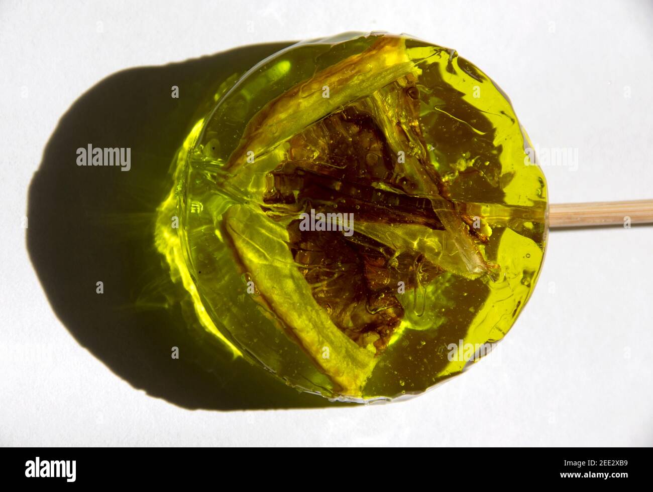 Yellow lollipop with lemon slice inside on white background Stock Photo ...
