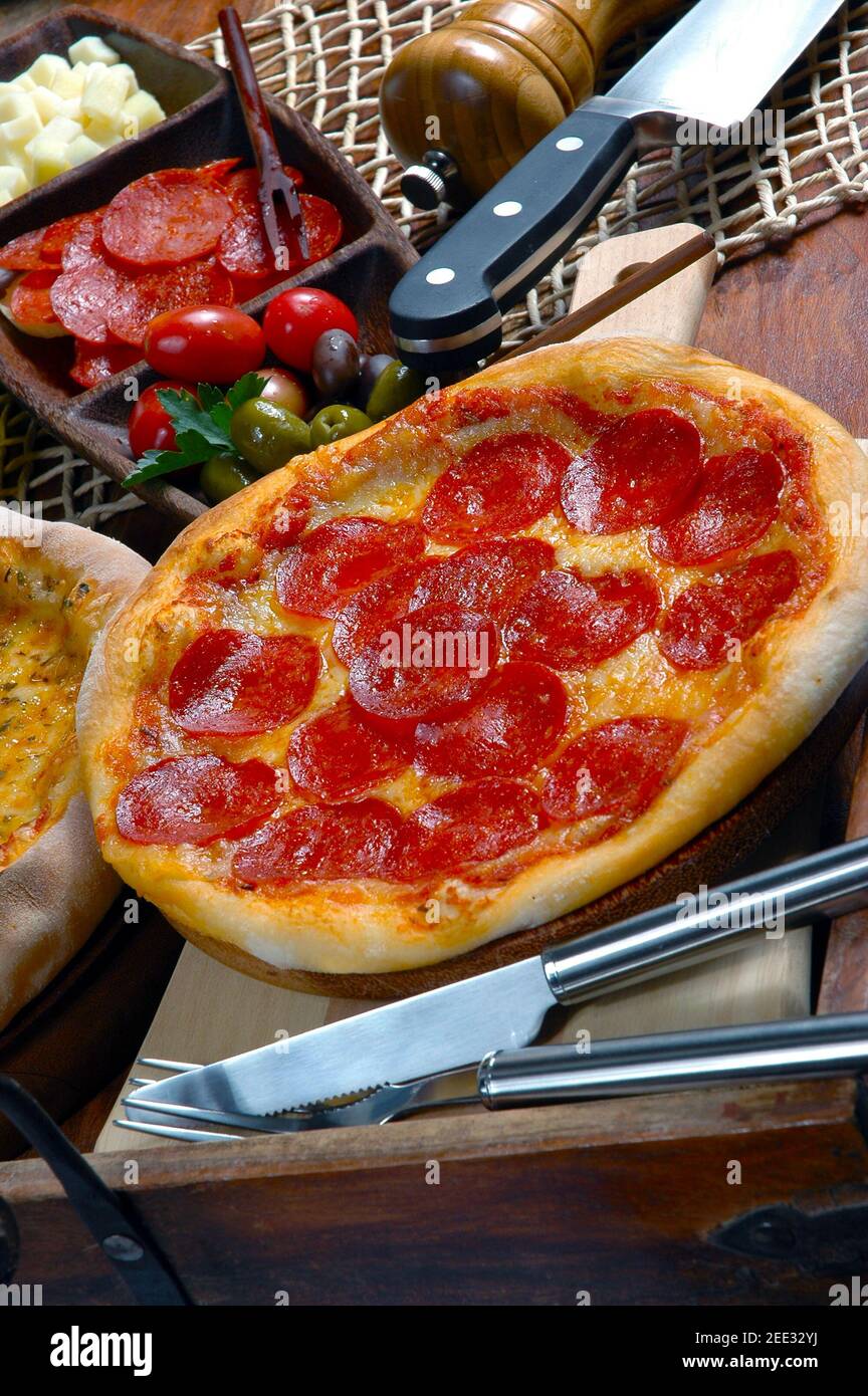Pizza pepperoni with olive oil Stock Photo - Alamy
