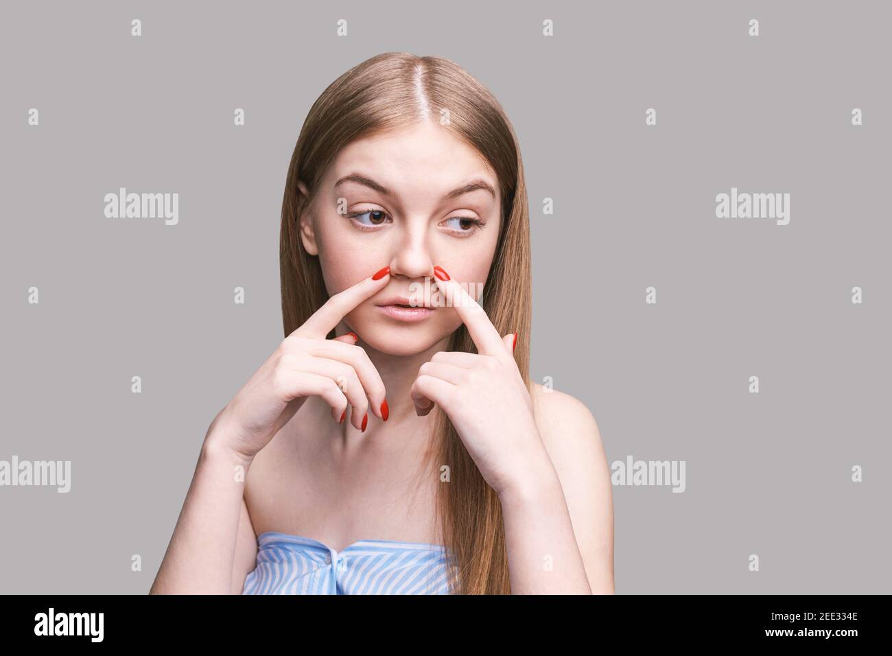 Girl point at nose hi-res stock photography and images - Alamy