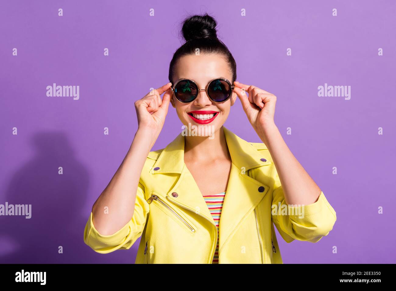 Portrait of pretty youth girl toothy smile in camera touch cool specs ...