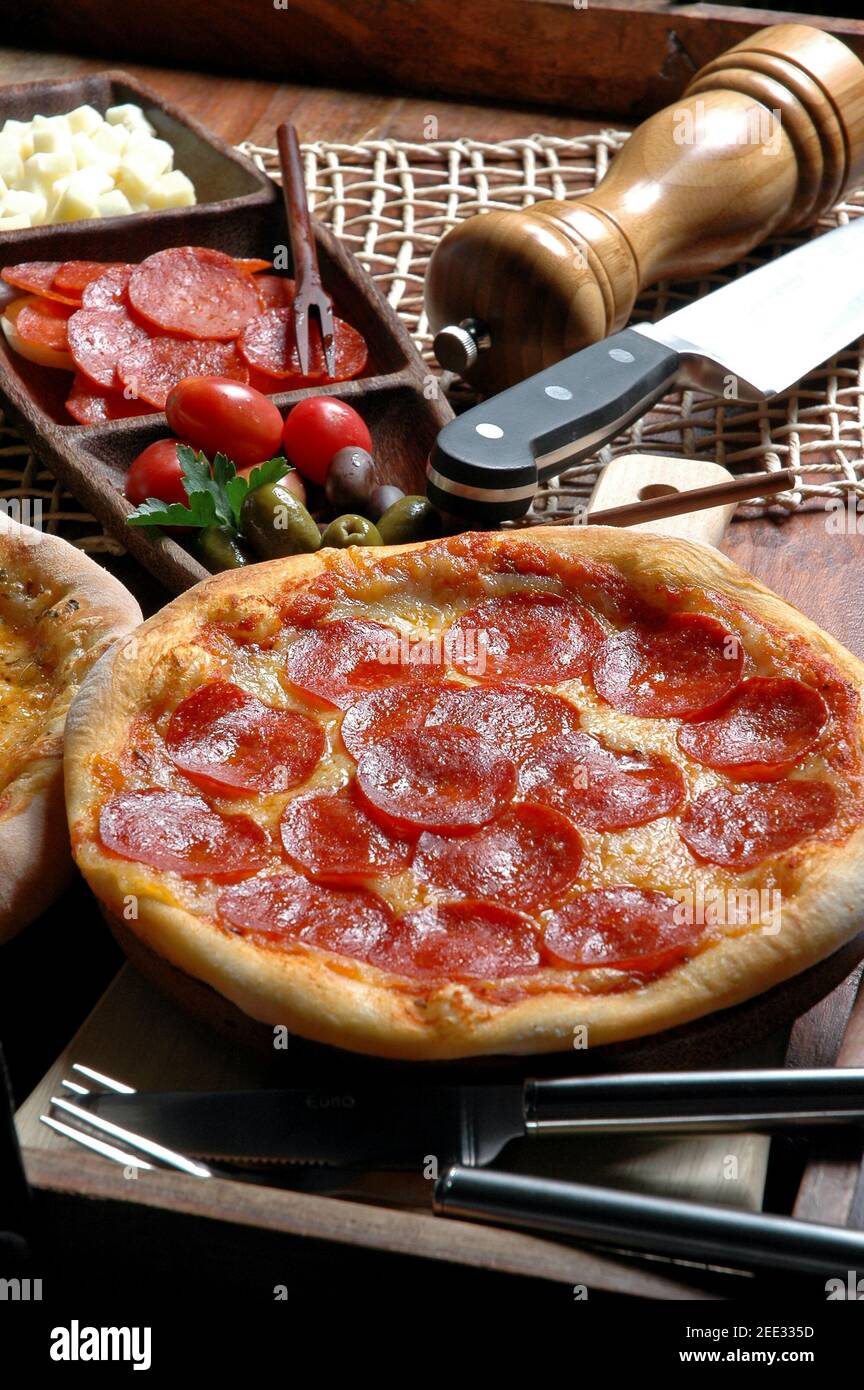 Pizza pepperoni with olive oil Stock Photo - Alamy