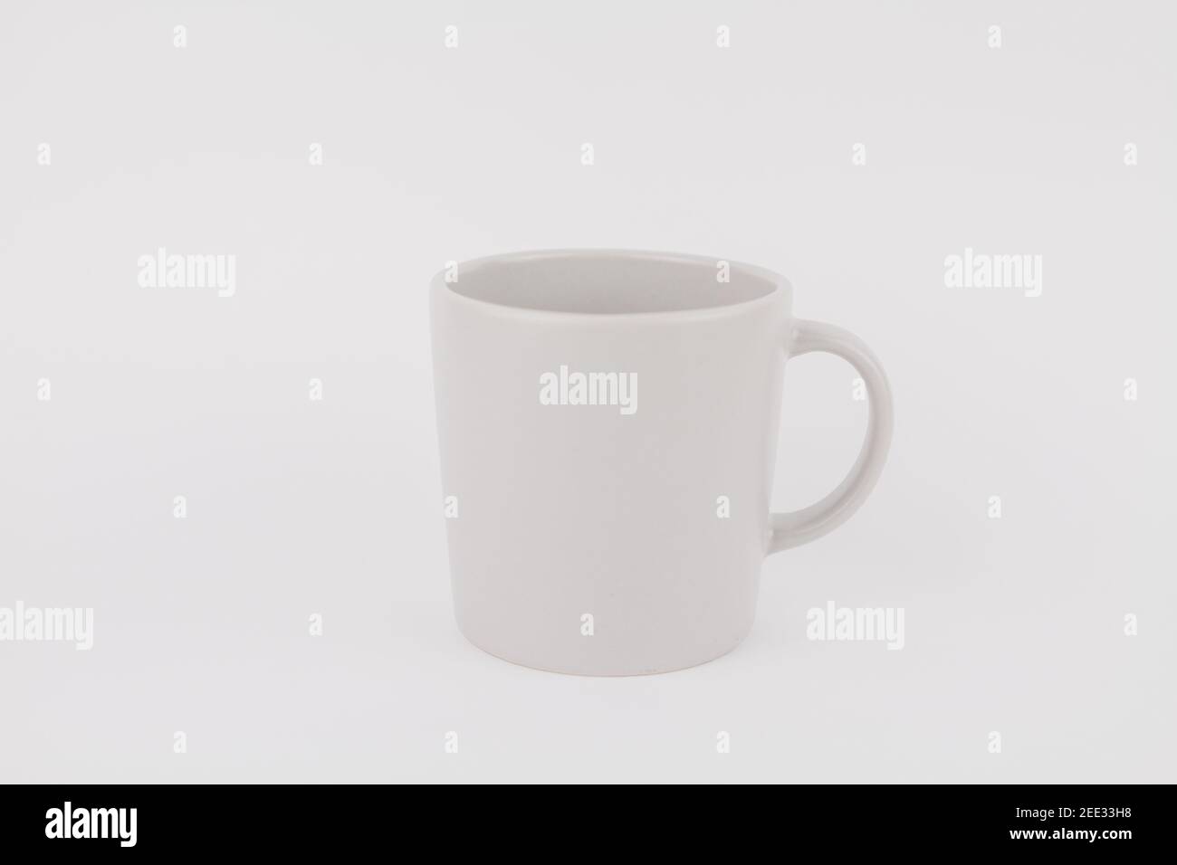 empty new gray cup on a white background Stock Photo - Alamy