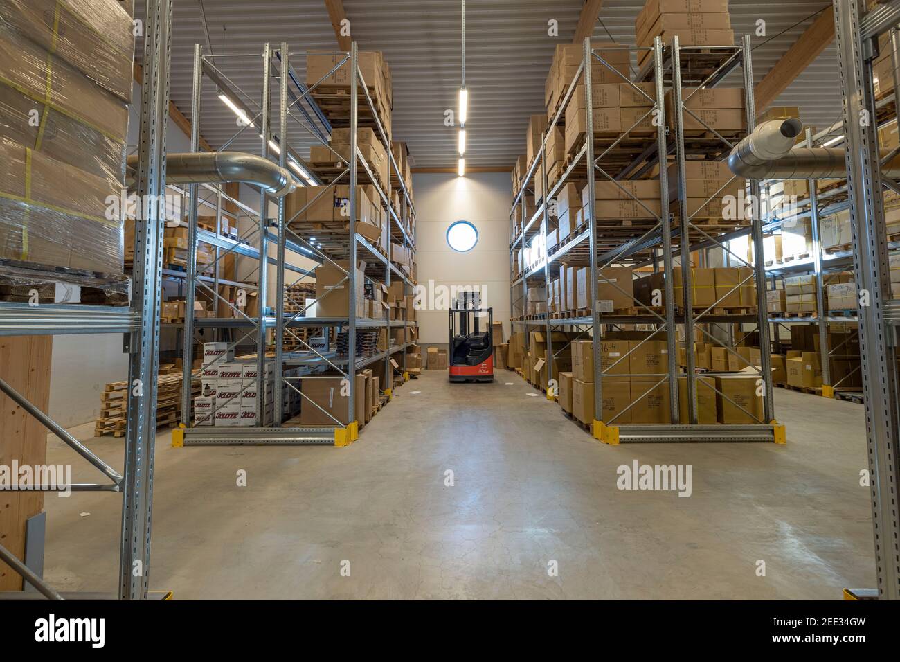 Close up view of storage warehouse. Fork lift truck in warehouse store ...