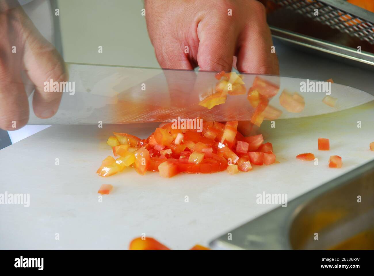 Hand slicing red tomato knife hi-res stock photography and images - Alamy