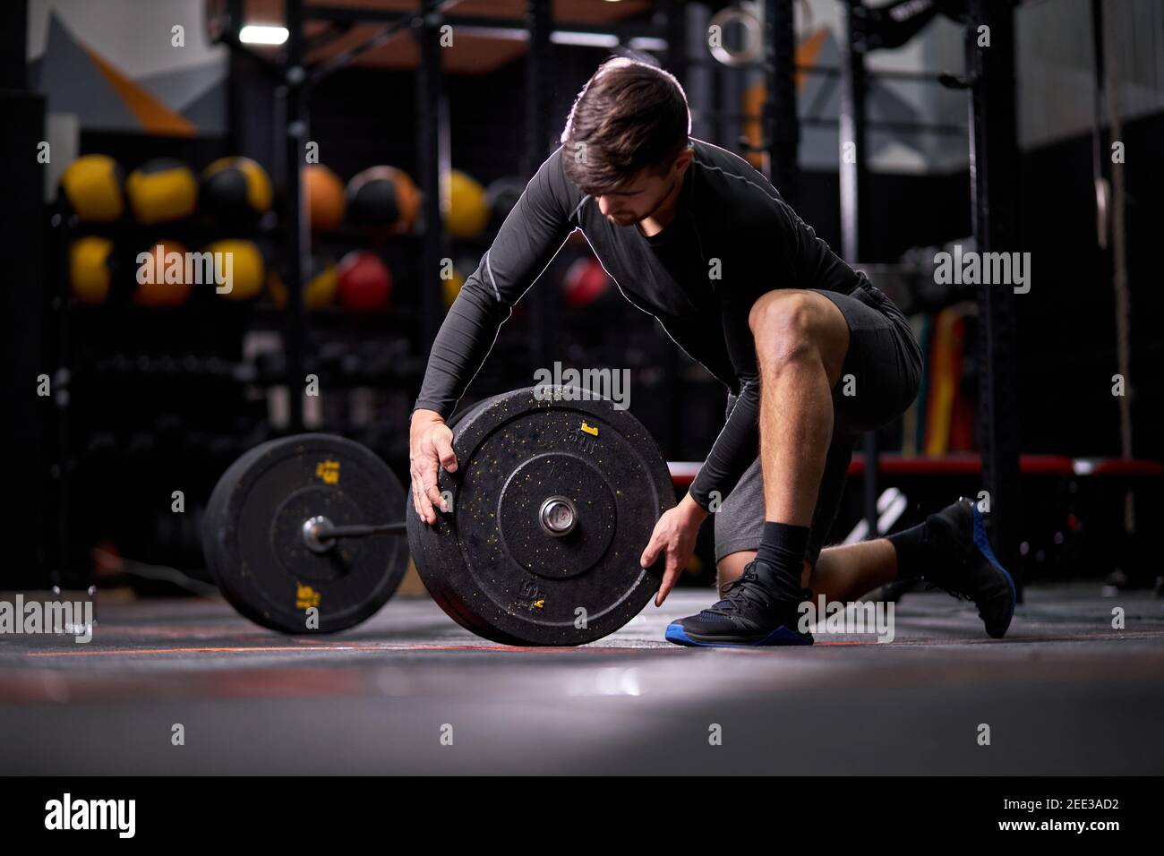 Adding weights hi-res stock photography and images - Alamy