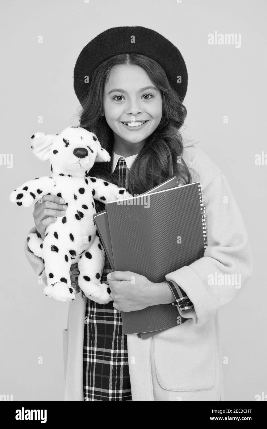 best friend. girl hold dog toy and books. back to school. retro girl ...