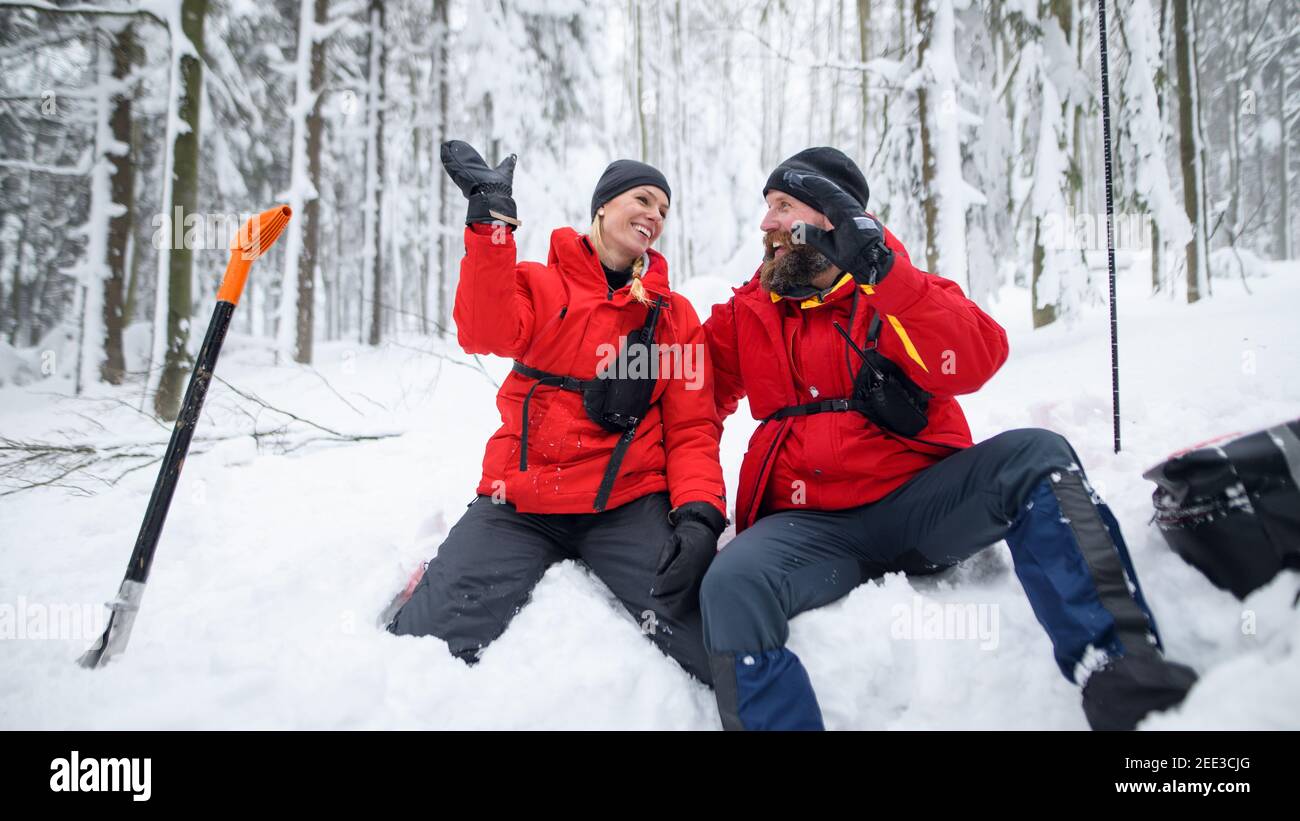 Mountain rescue service on operation outdoors in winter in forest ...