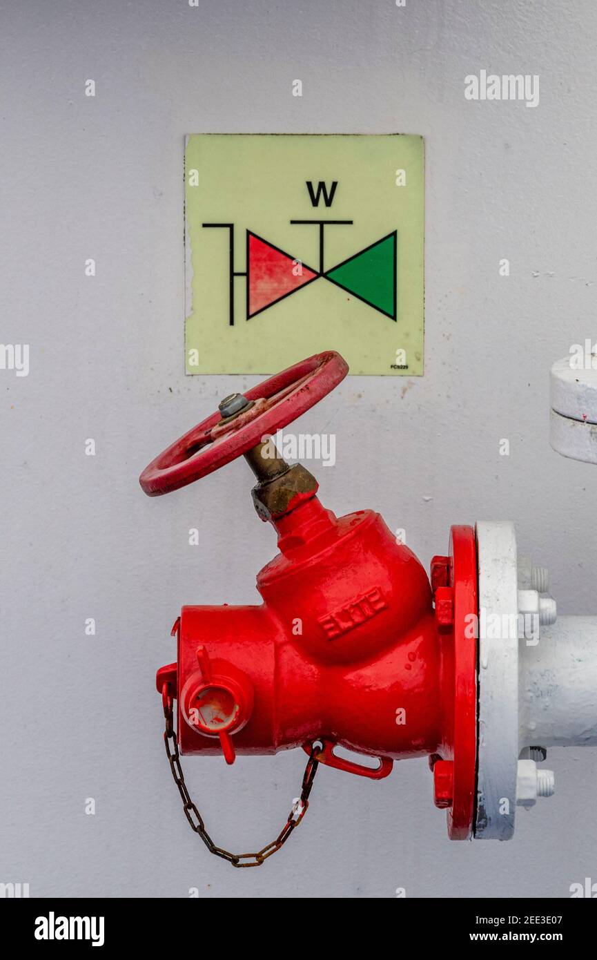 an old style hand-wheel fire hydrant on a ship for firefighting ...