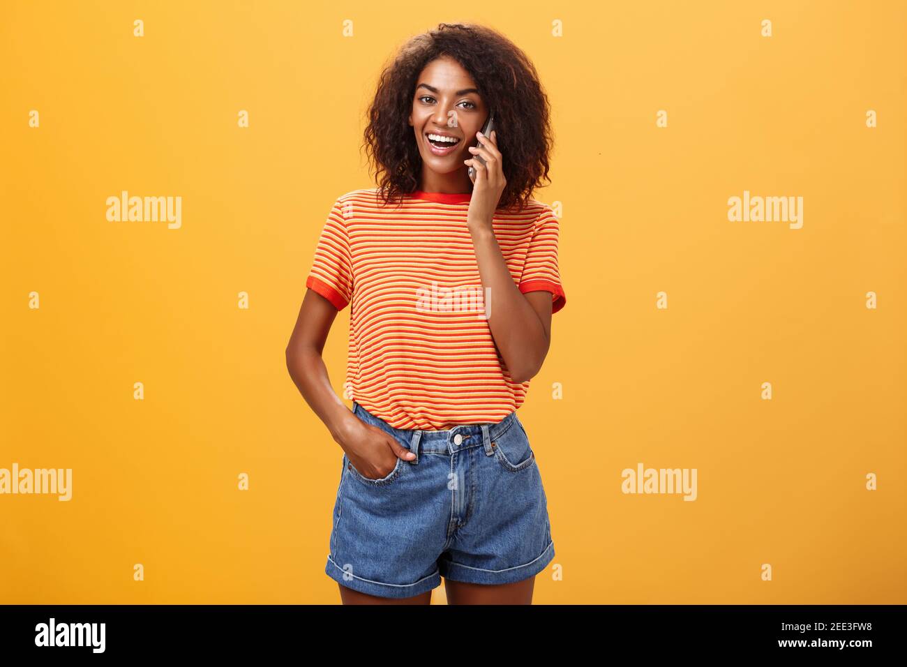 Indoor shot of stylish confident female coworker in trendy t-shirt and ...