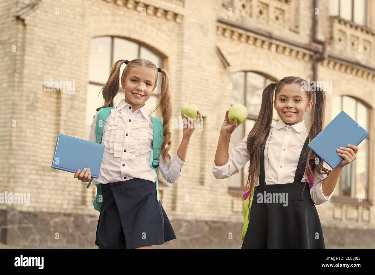 best friends from school. back to school. two small girls ready to ...
