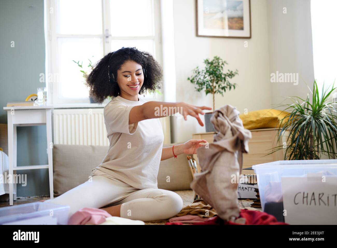 Woman sorting clothes home hi-res stock photography and images - Alamy