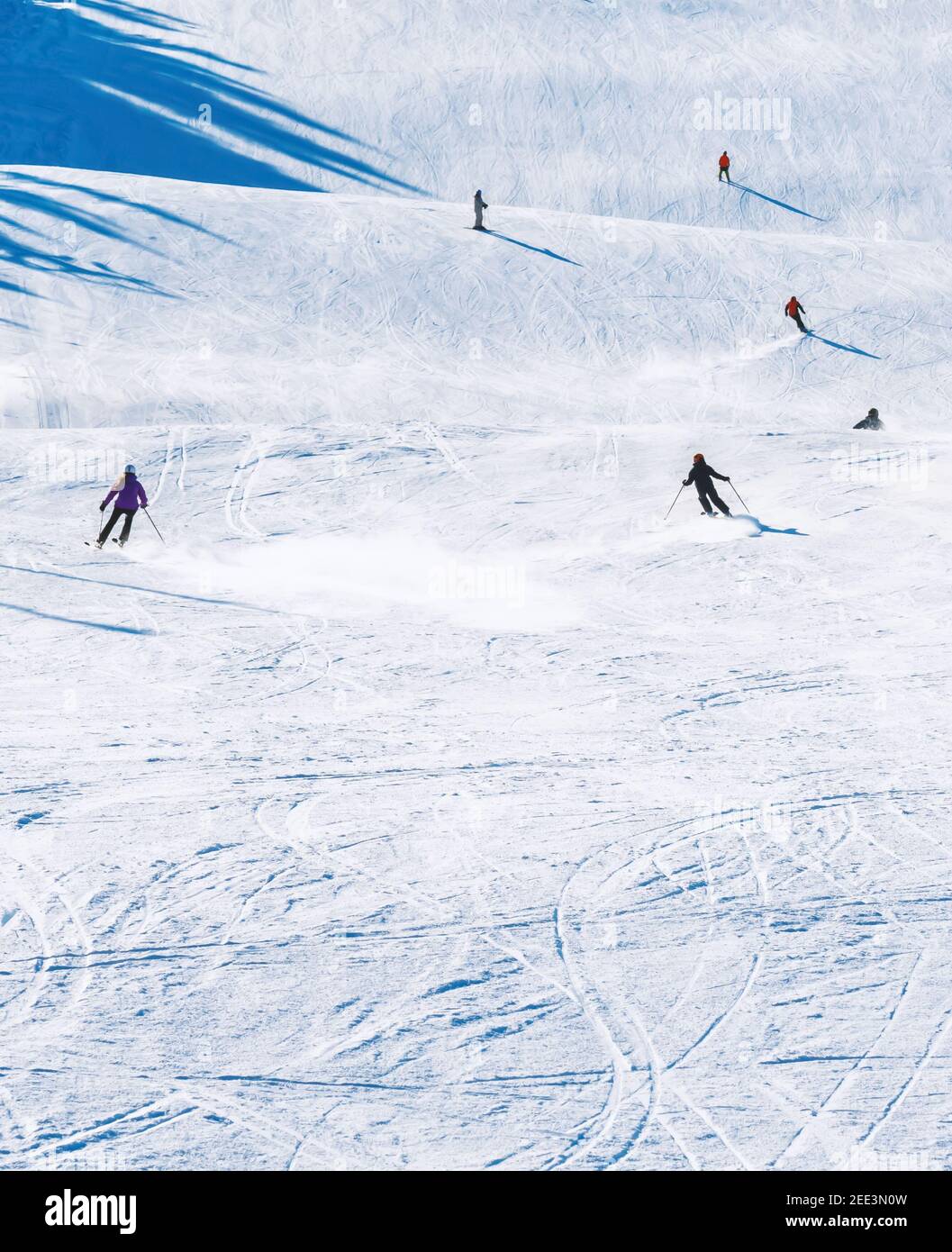 People riding down ski slope hi-res stock photography and images - Alamy