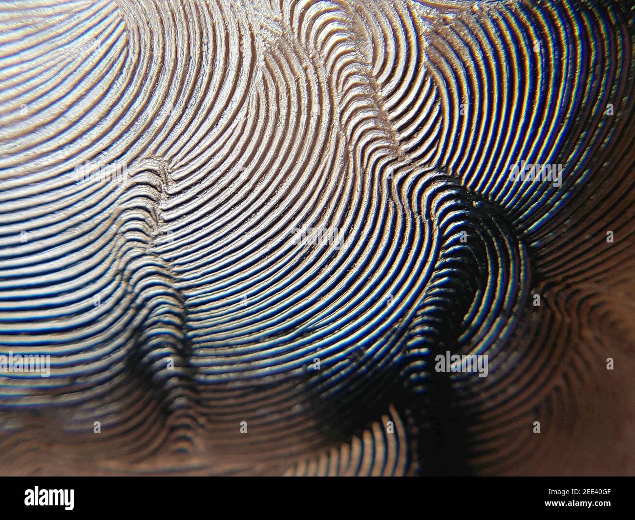 Undulating patterns created on a plain surface by light interacting ...