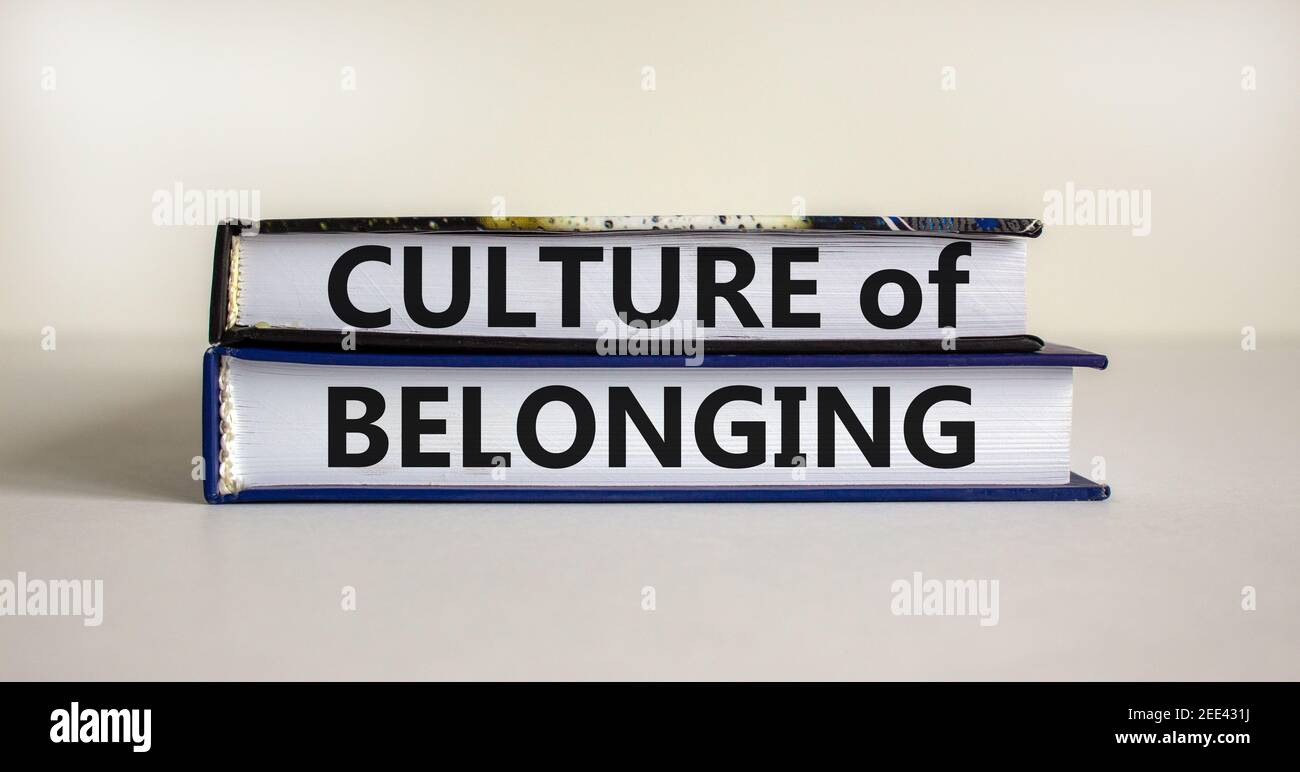 Culture of belonging symbol. Books with words 'culture of belonging' on beautiful white ...