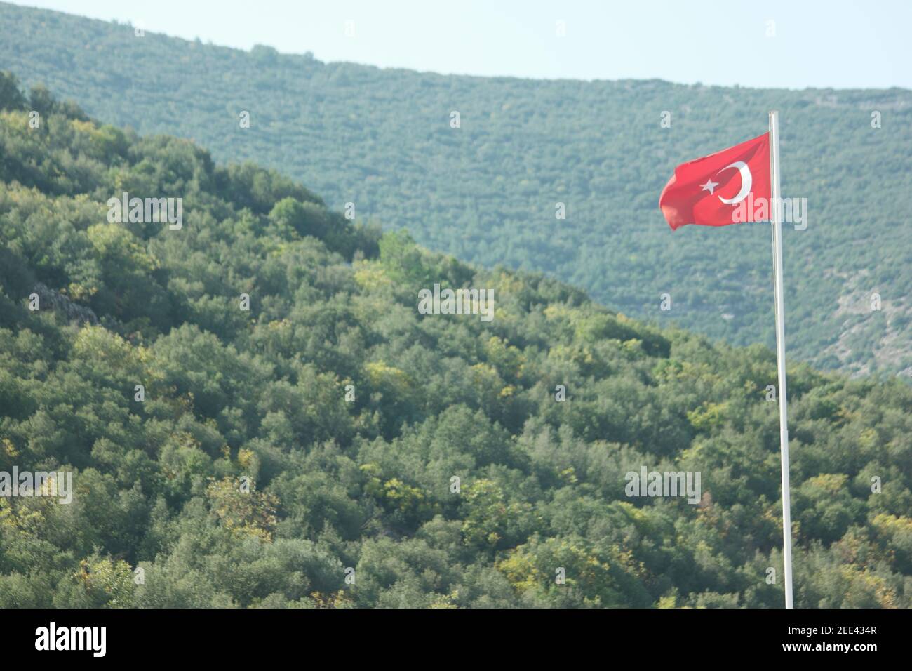 Flag of Turkey on the background of green mountains Stock Photo - Alamy