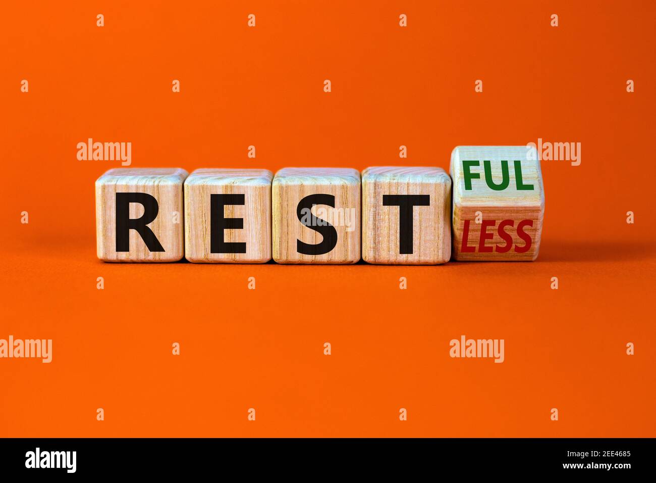 Restless or restful symbol. Turned the wooden cube, changed the word ...