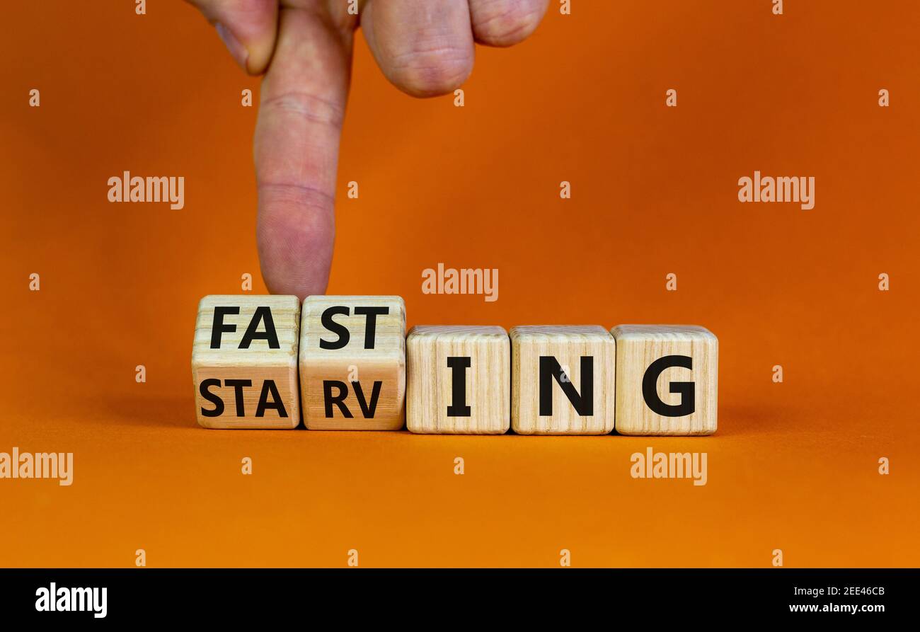 Fasting or starving symbol. Doctor turns wooden cubes and changes the ...