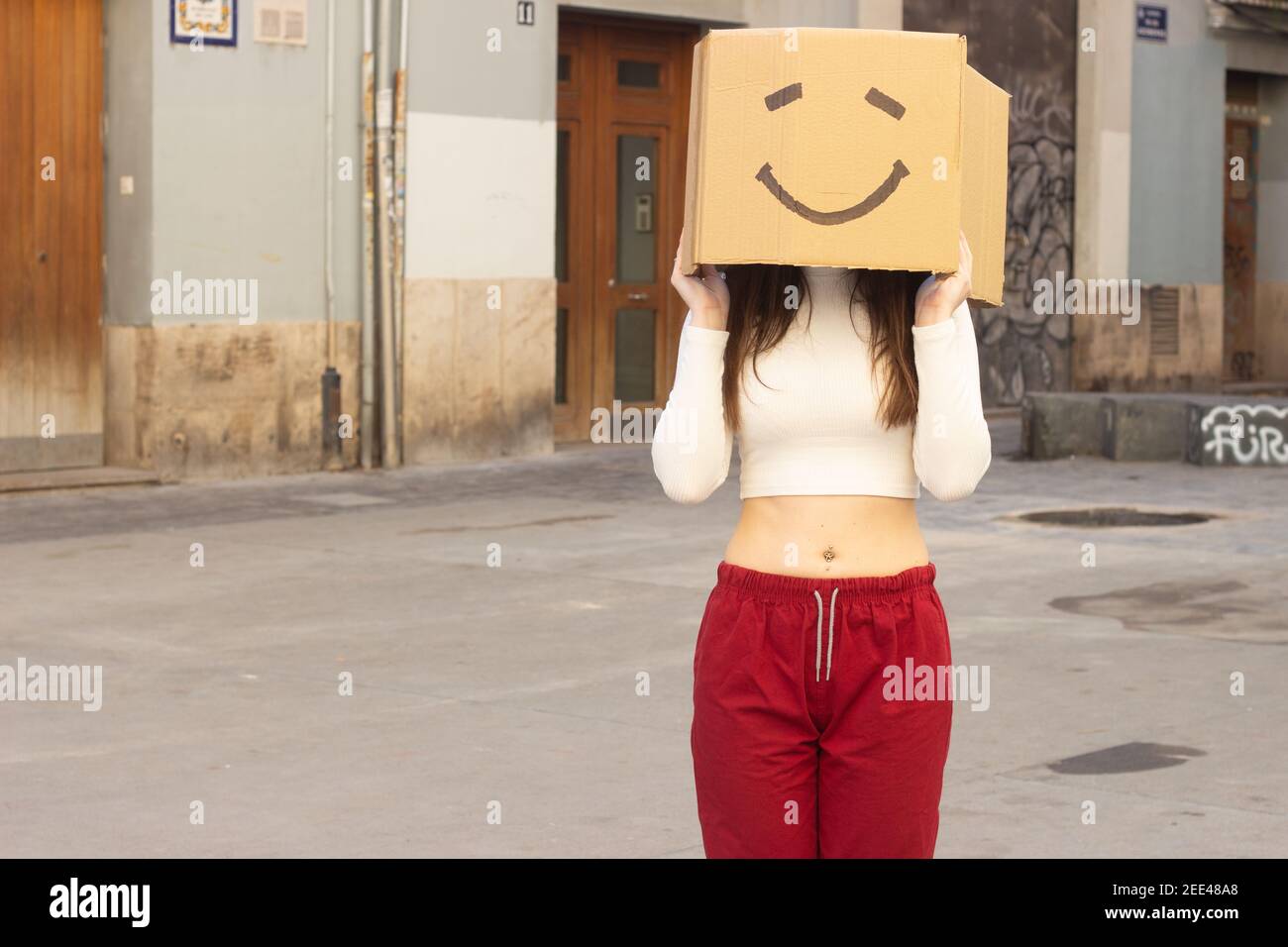 Woman wearing cardboard box happy face hi-res stock photography and ...