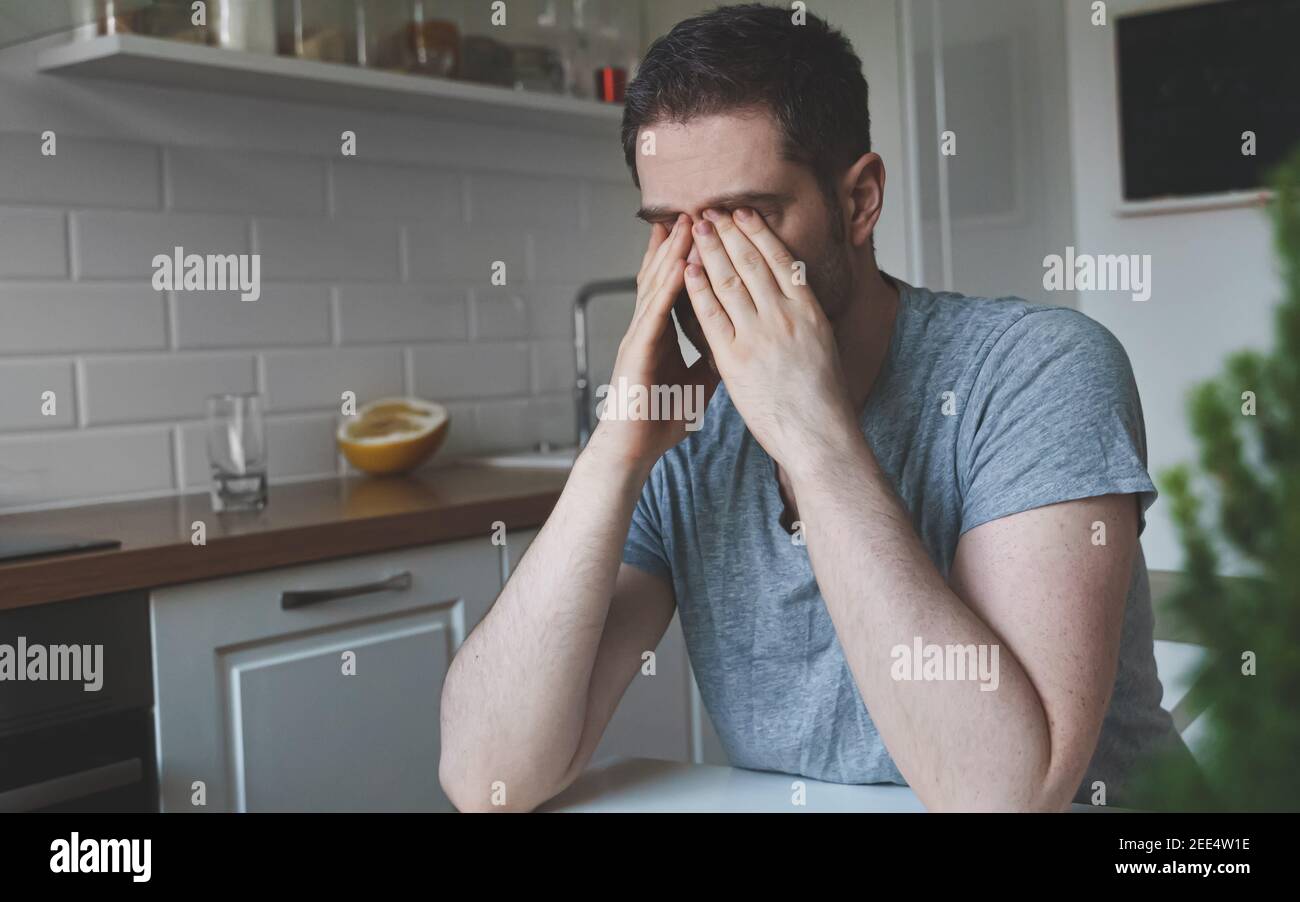 Man headache kitchen hi-res stock photography and images - Alamy
