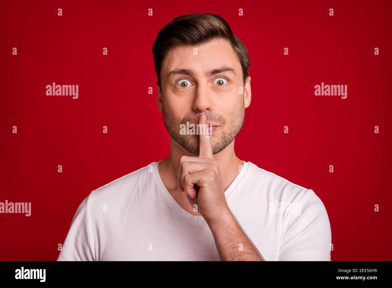 Photo of positive person finger covering lips mouth do not tell look ...