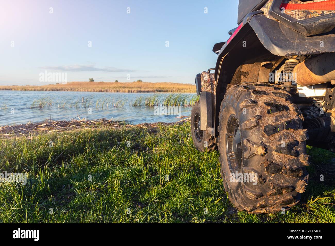 ATV awd quadbike motorcycle pov view near lake or river pond coast with ...