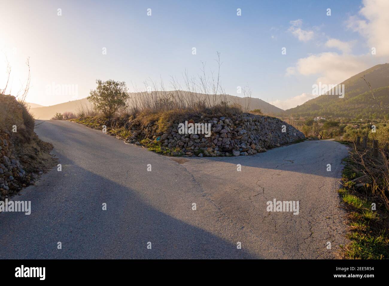 Road splitting into two parts Stock Photo - Alamy