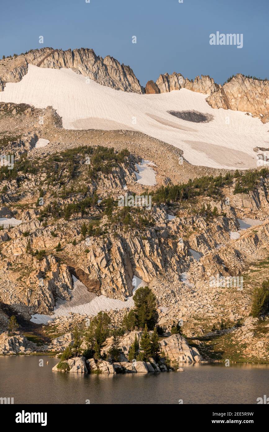 Subalpine lake, slope, snowfied and serrated ridge, Wallowa Mountains ...