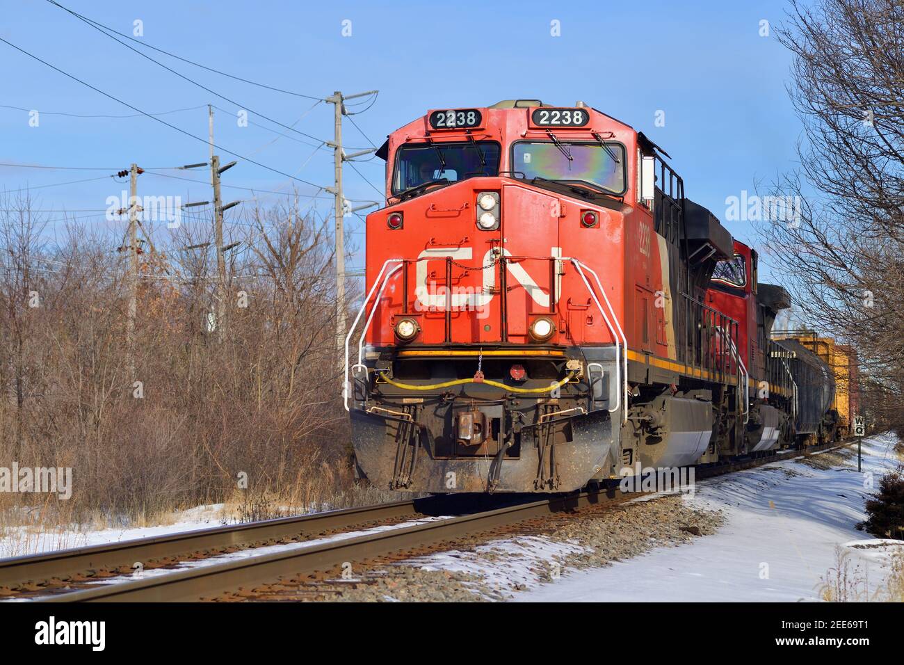 Barrington, Illinois, USA. Canadian National Railway locomotives lead a ...