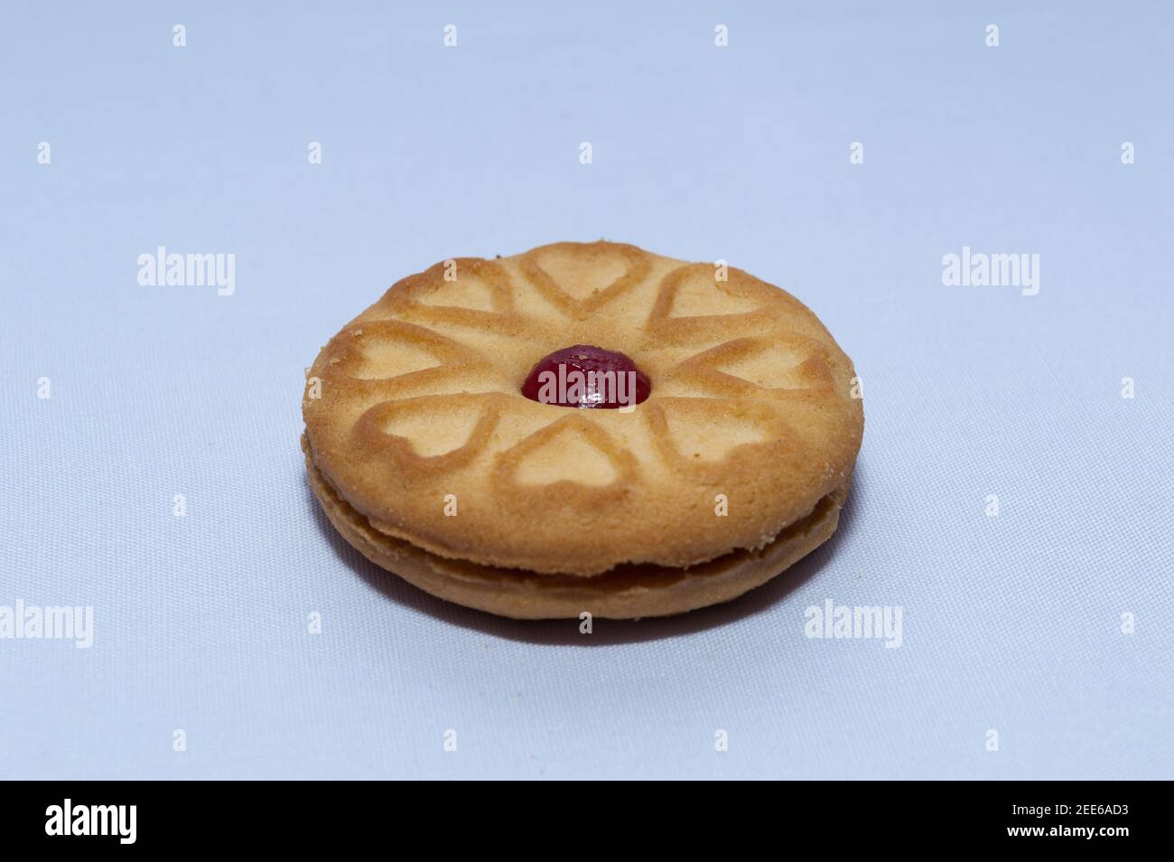 Red centered jam biscuits with a strawberry flavor on a plain white ...