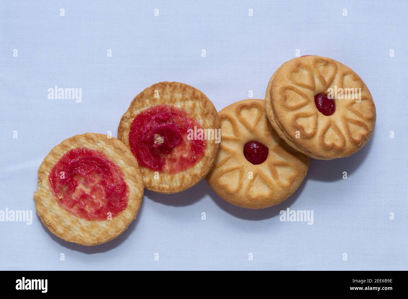 Red centered jam biscuits with a strawberry flavor on a plain white ...