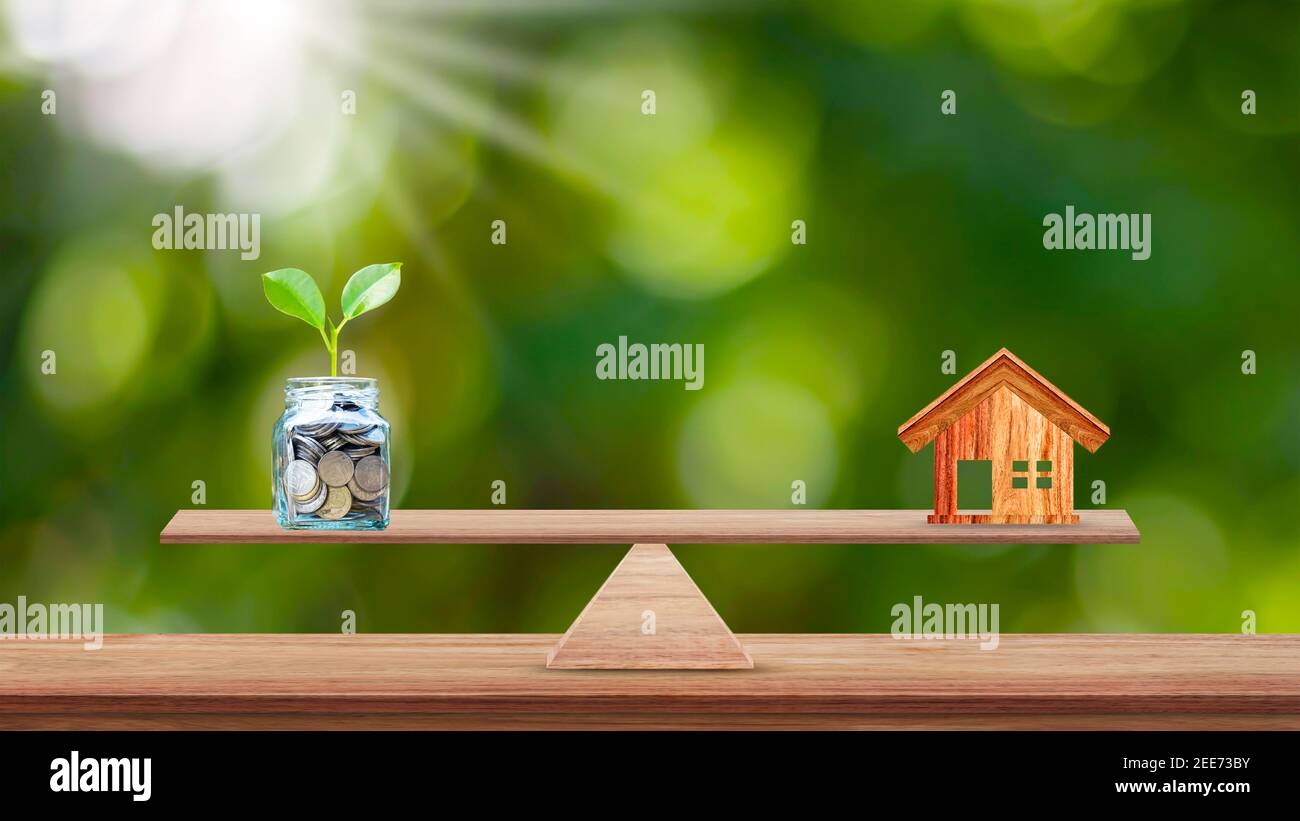 Concept scales money house hi-res stock photography and images - Alamy