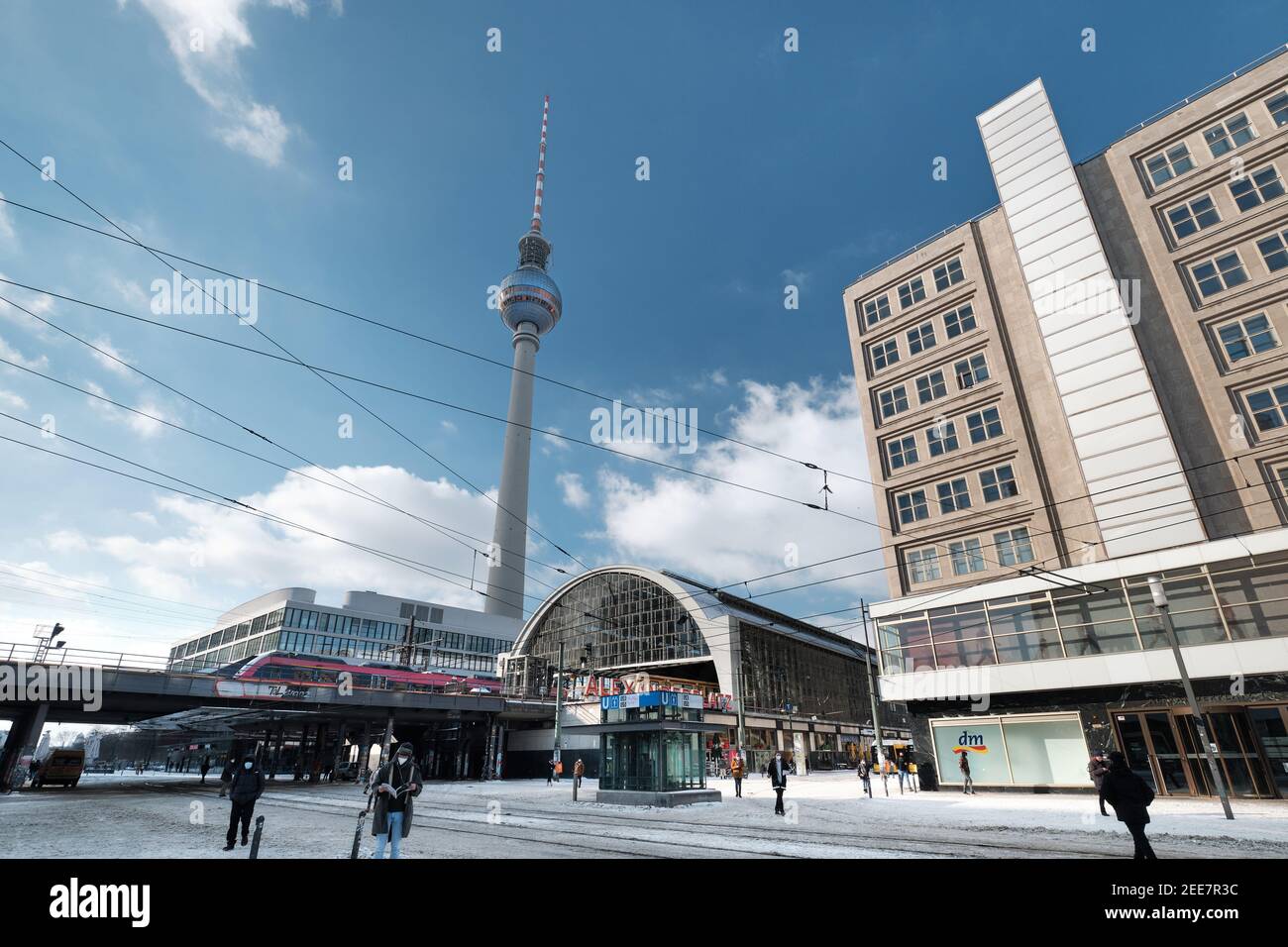 Berlin under snow. Alexanderplatz square covered with snow. Blue sky ...