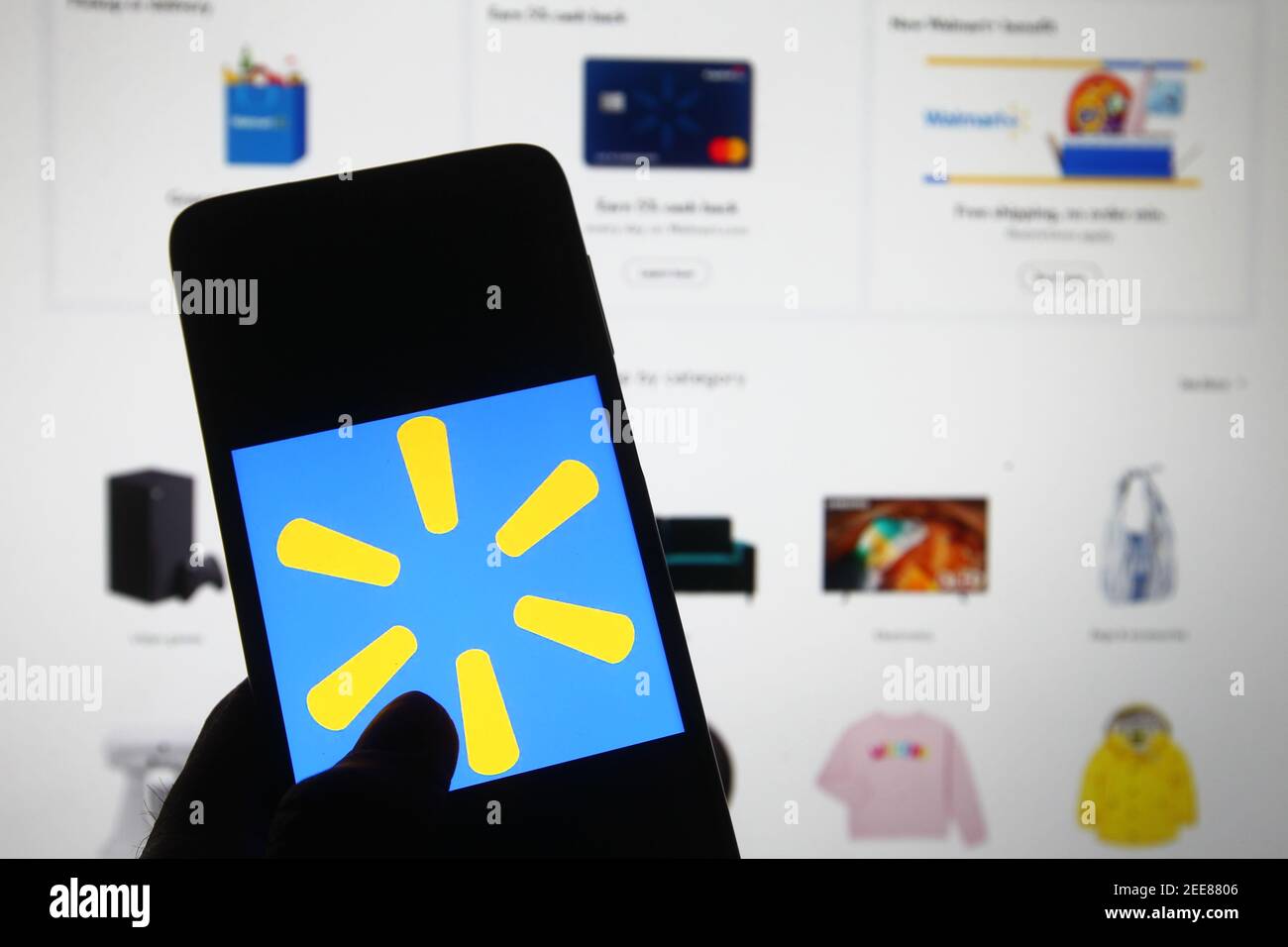 In this photo illustration, Walmart logo is seen displayed on a ...