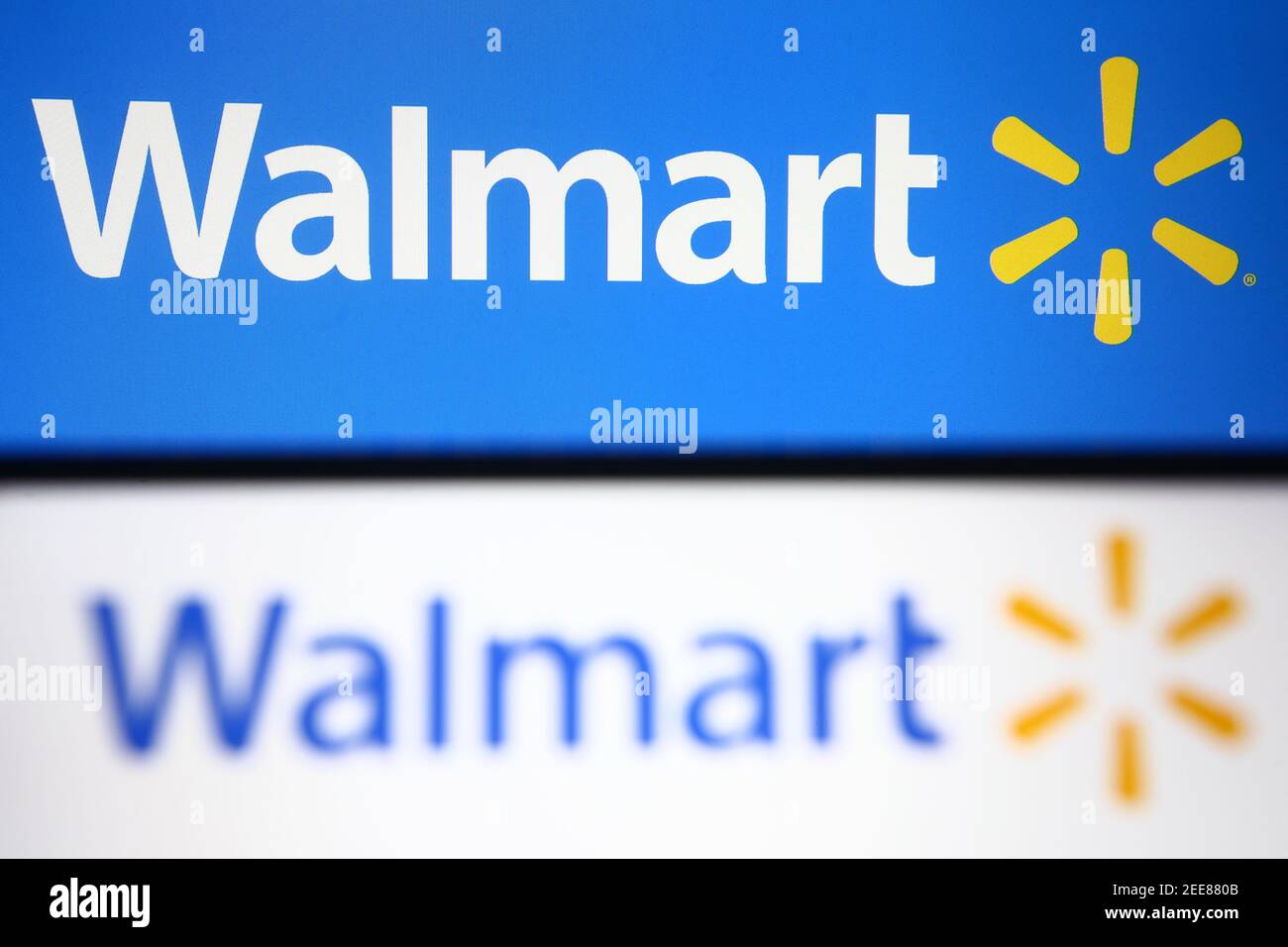 In this photo illustration, Walmart logo is seen displayed on a ...