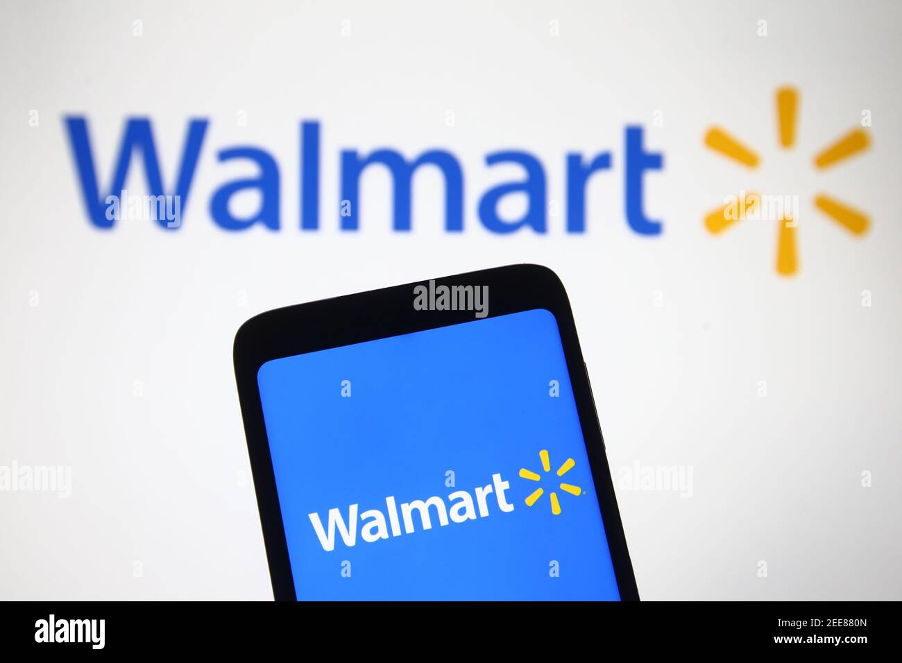 In this photo illustration, Walmart logo is seen displayed on a ...