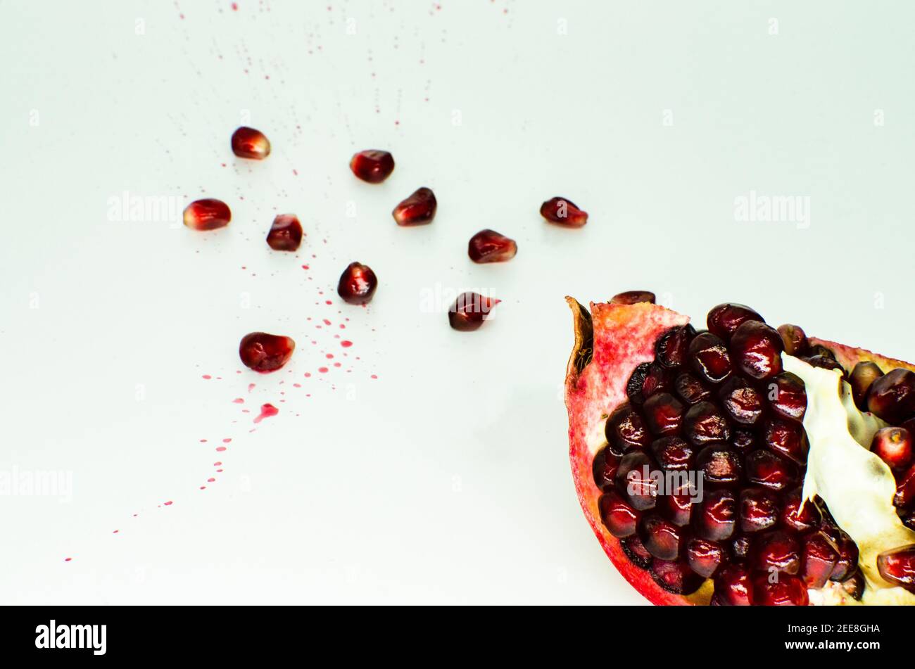 peeled pomegranate closeup isolated on white background Stock Photo - Alamy
