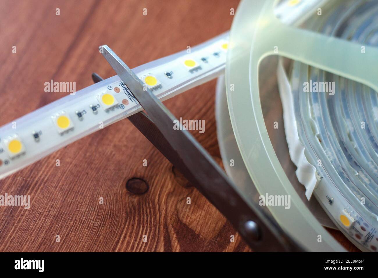 cutting off excess pieces of LED strip Stock Photo - Alamy
