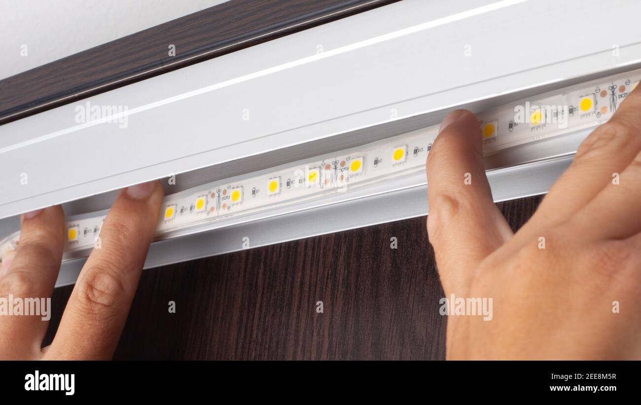 installation of LED strip in the office to highlight the wardrobe ...