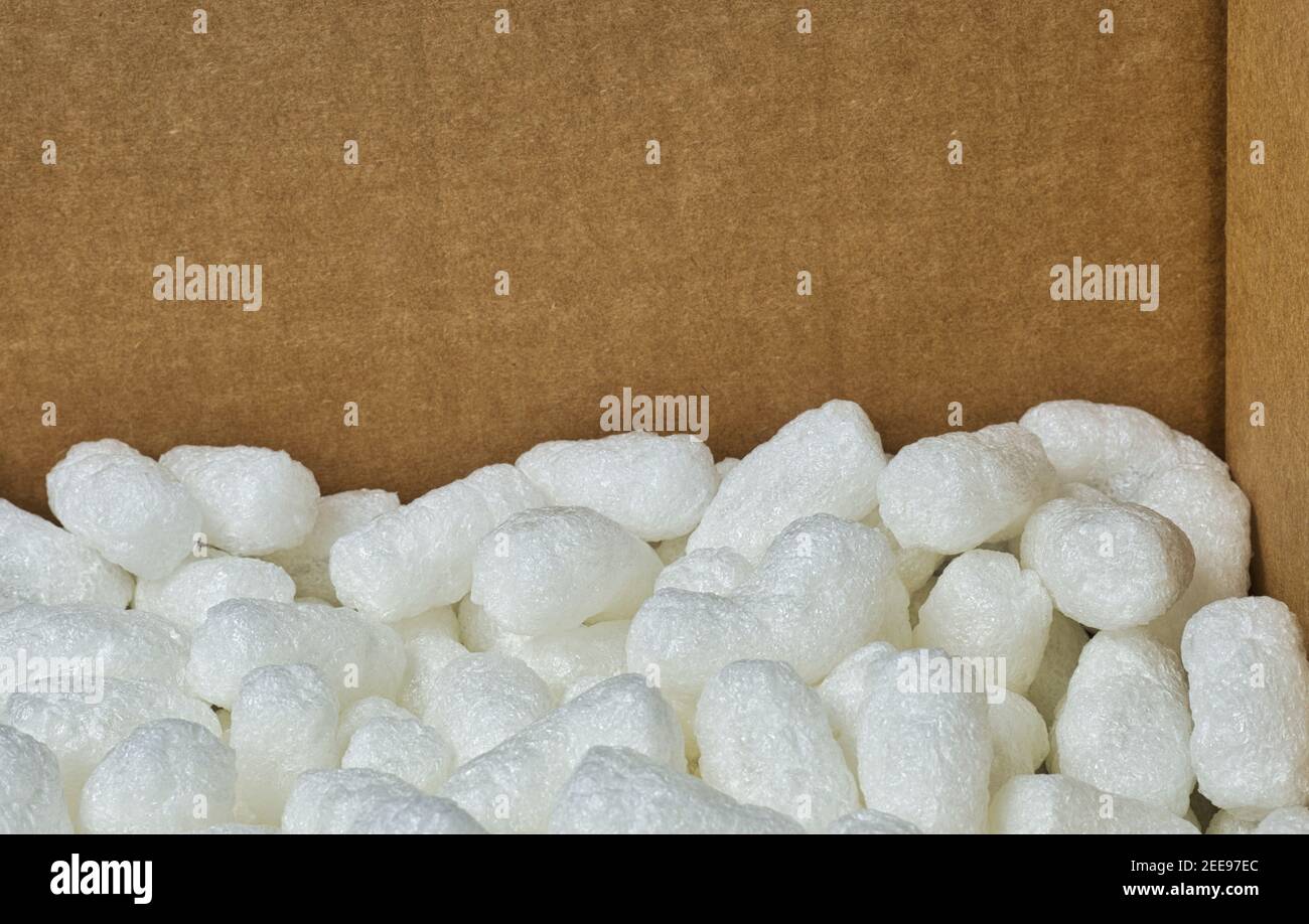 White packing peanuts styrofoam popcorn packaging material inside a ...