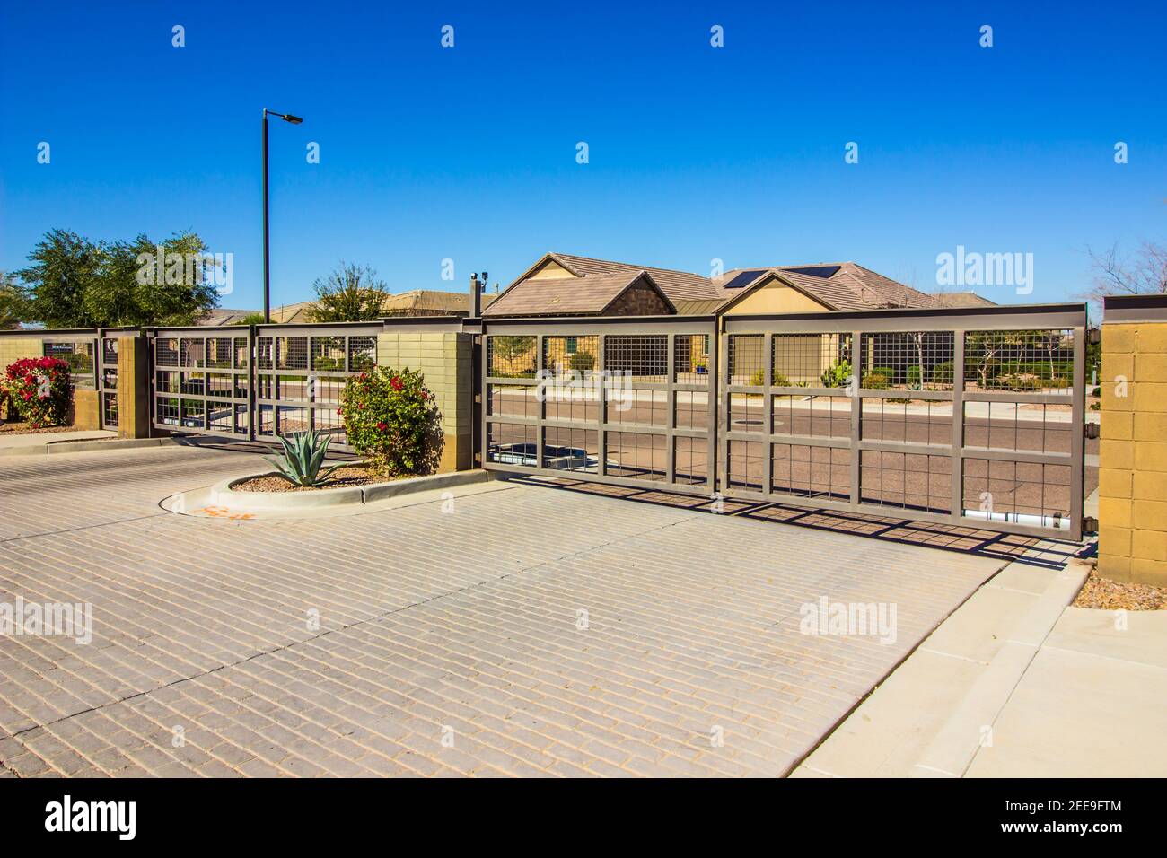 Entrance & Exit Access Gates For Secure Home Development Stock Photo ...