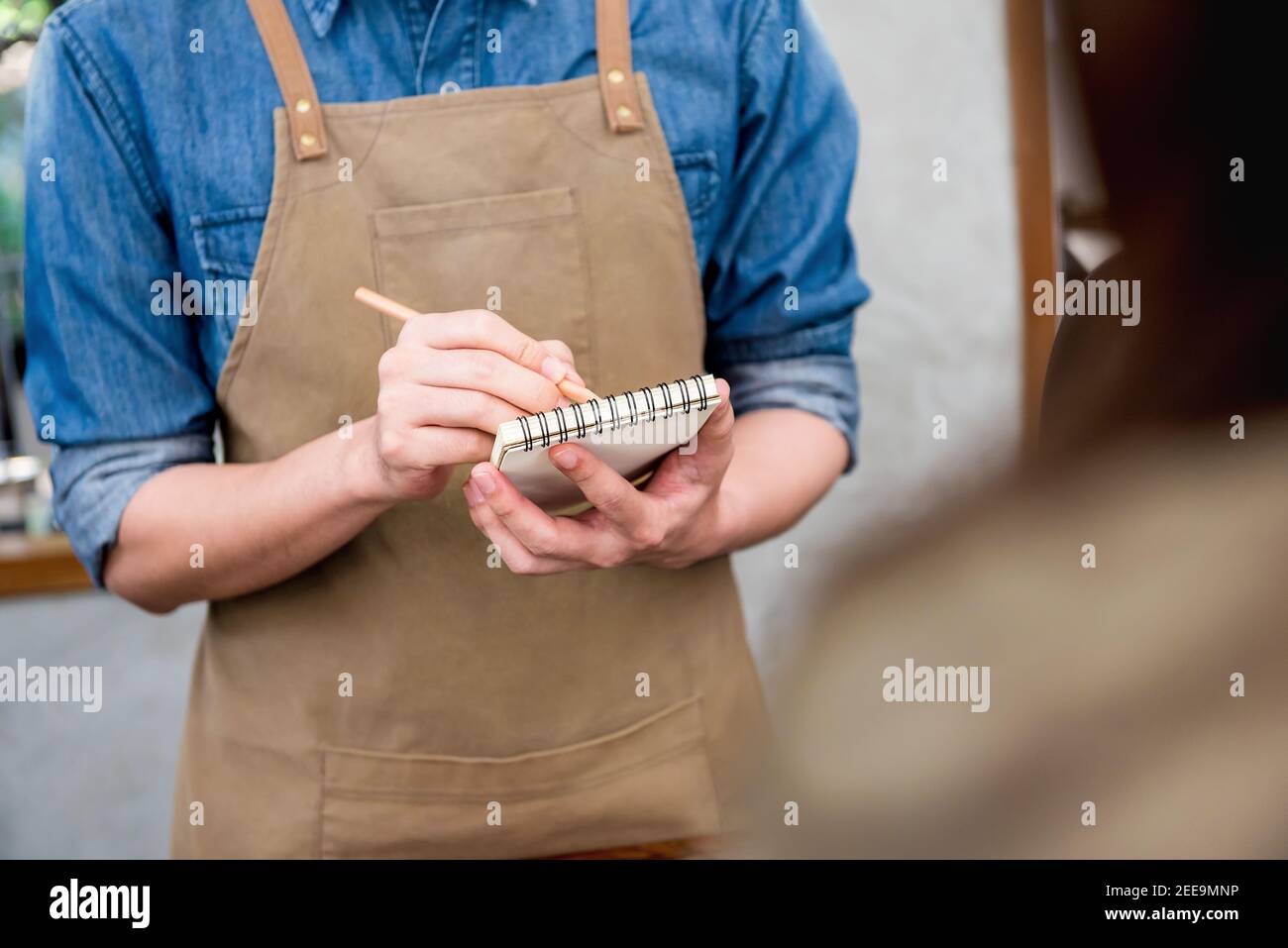 Taking order at counter hi-res stock photography and images - Alamy