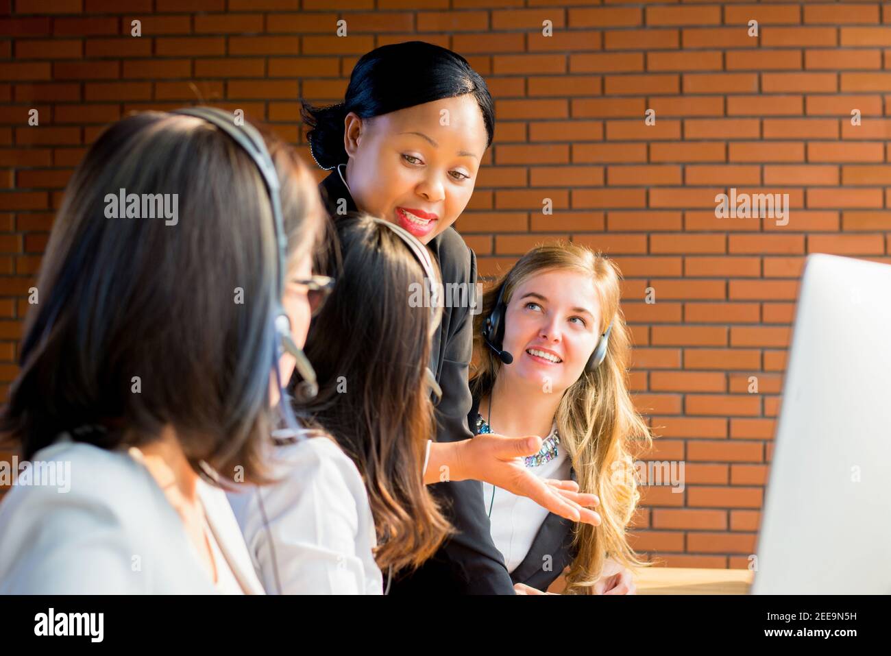 Friendly black businesswoman supervisor training work to her ...