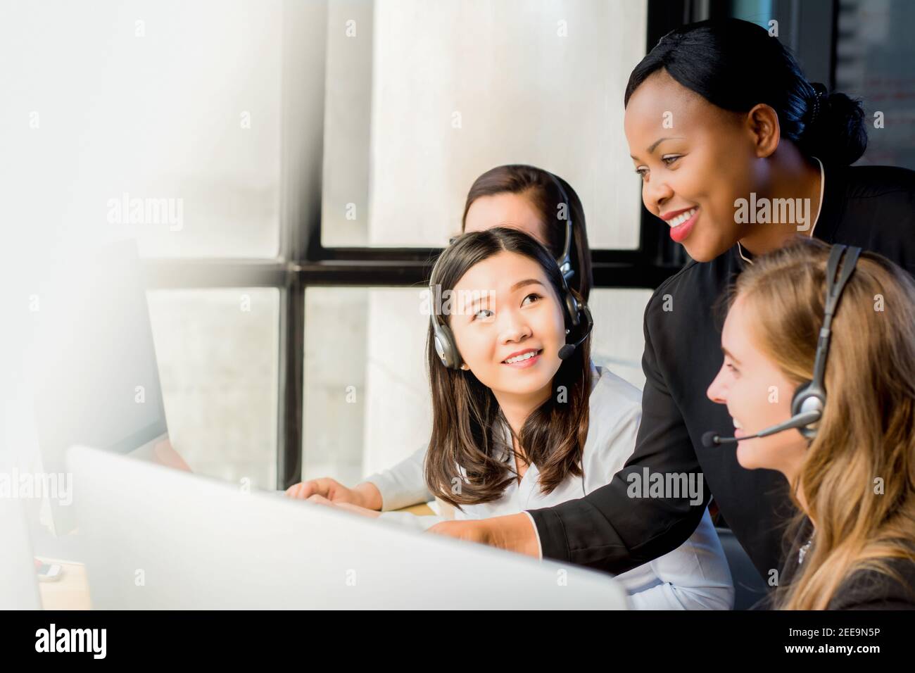 Friendly black businesswoman supervisor training work to her ...
