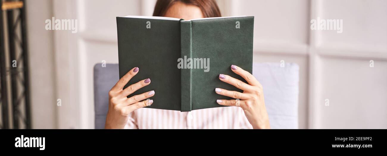 Girl hiding behind chair hi-res stock photography and images - Alamy