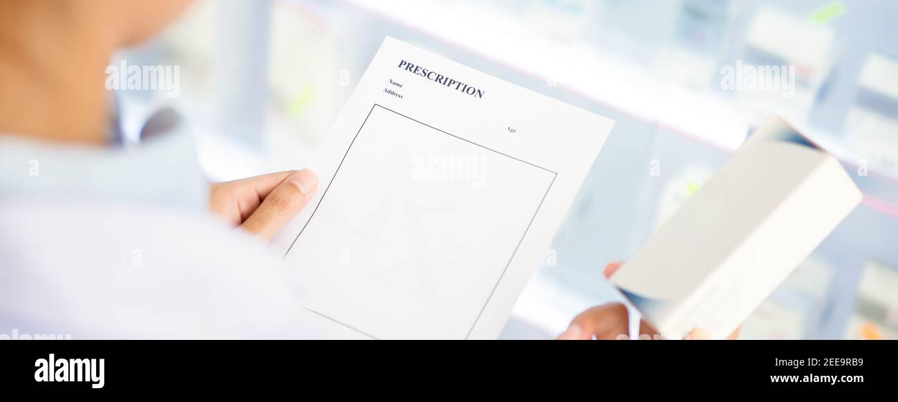 Female doctor checking prescription label hi-res stock photography and ...