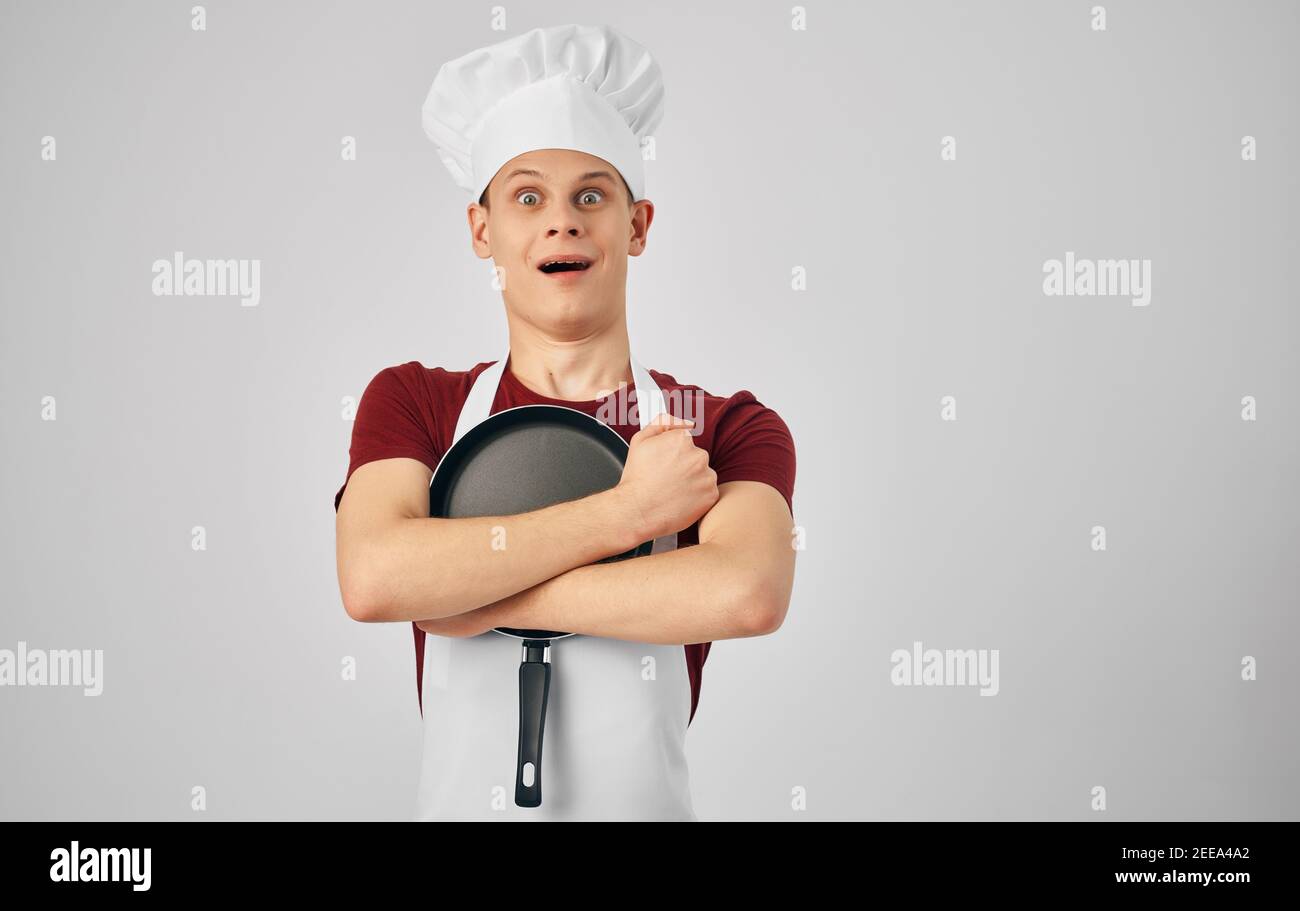 male chef with kitchen utensils cooking food service Stock Photo - Alamy