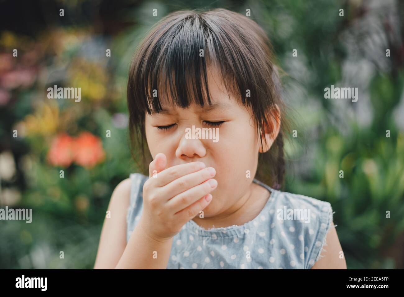 Kids using hand covering her mouth while cough which is incorrect ...