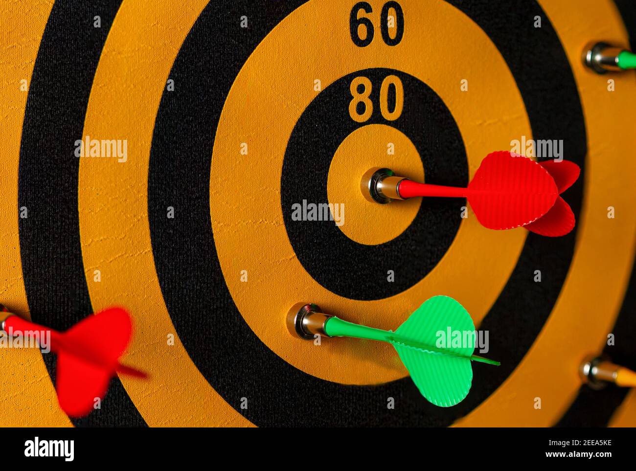 Close up image of a dart game in which one of the arrows hit the ...