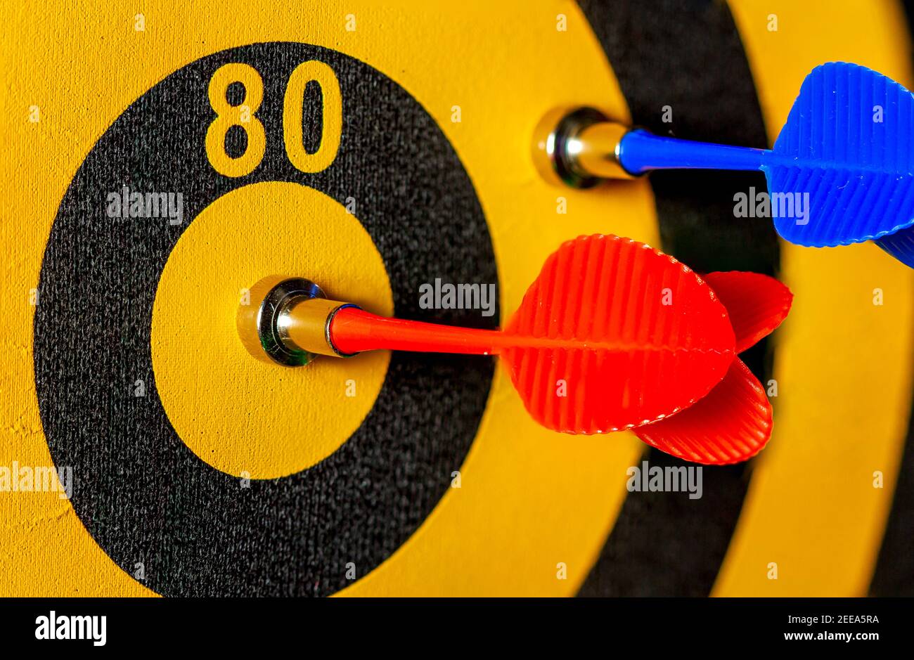 Close up image of a dart game in which one of the arrows hit the ...